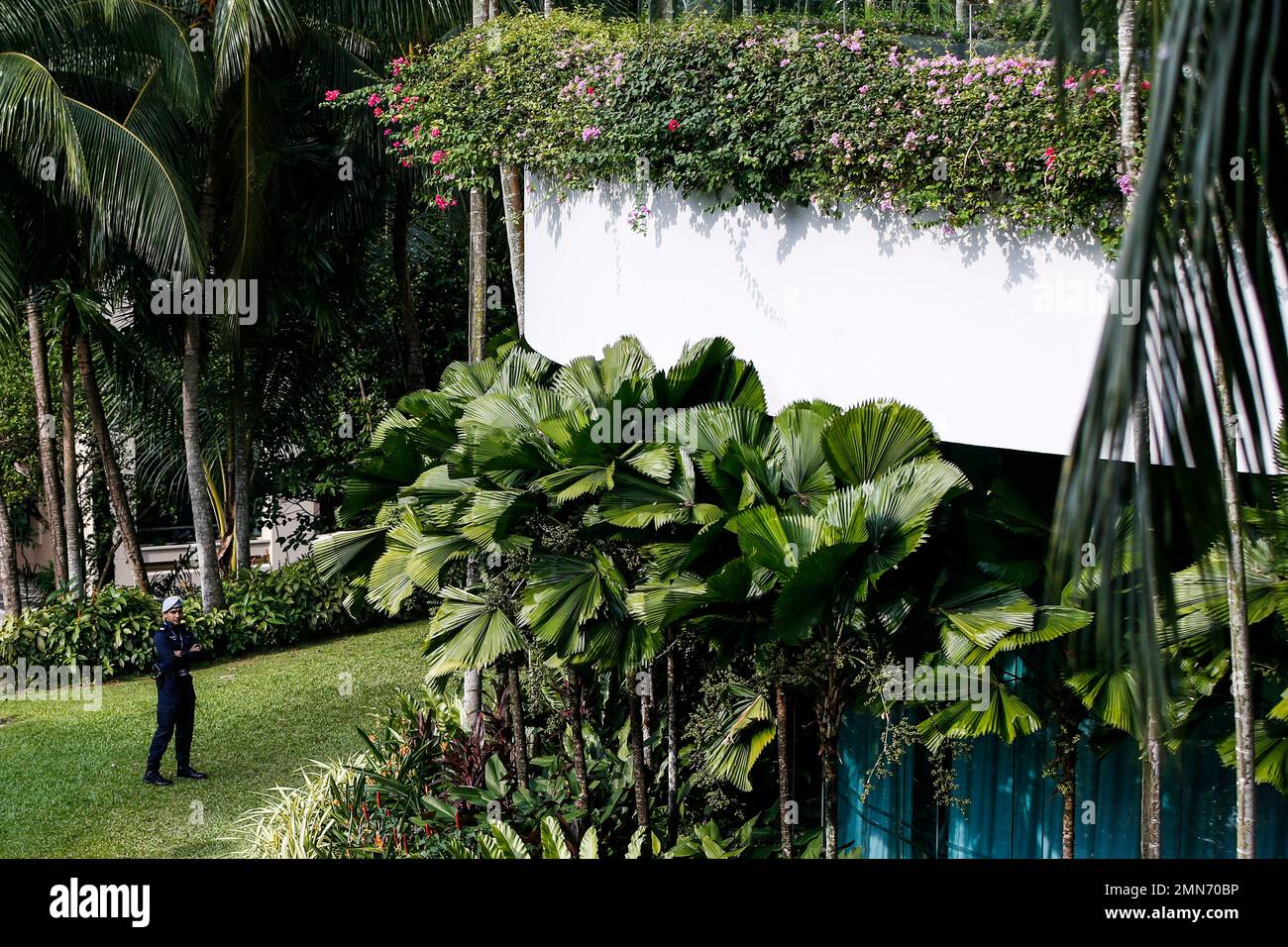 A police officer stands guard outside the Valley Wing of the Shangri-La ...
