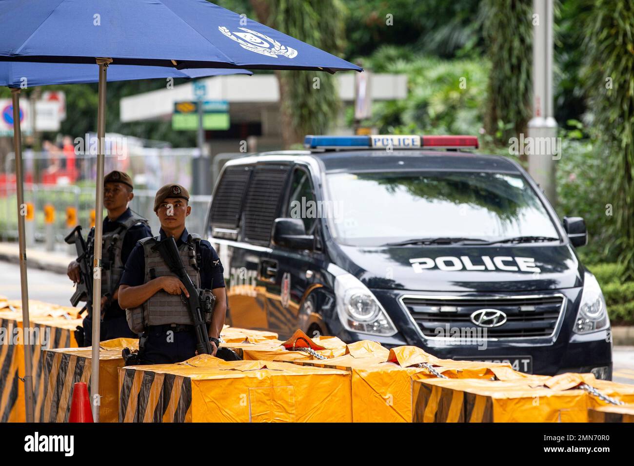 Gurkha police officers stand guard outside the St. Regis Hotel in ...