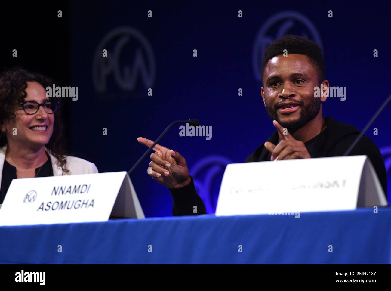 From left, Marcy Ross and Nnamdi Asomugha attend the first day of the ...