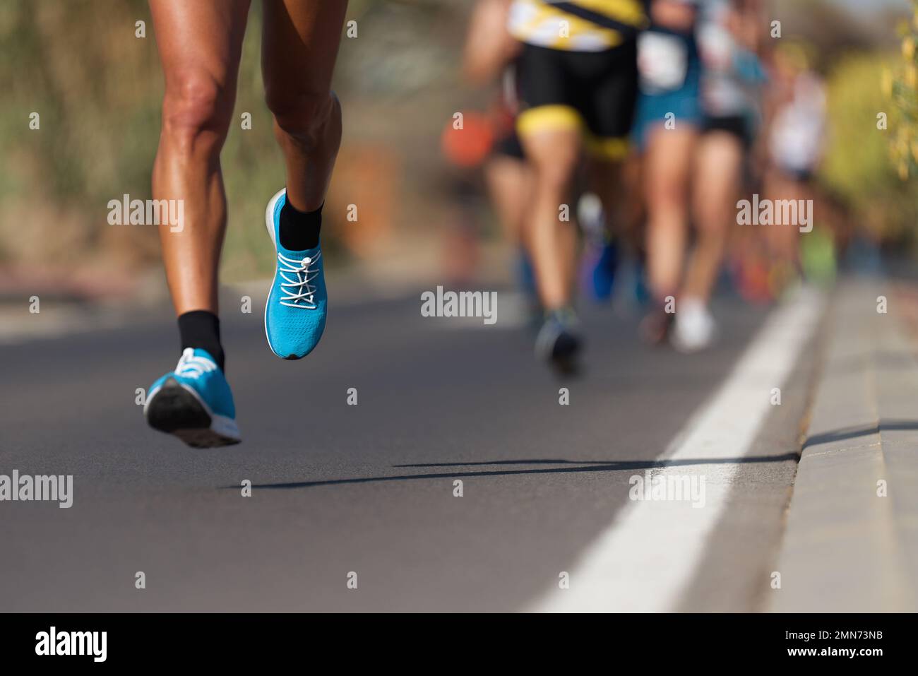 Marathon running race, people feet on city road Stock Photo - Alamy