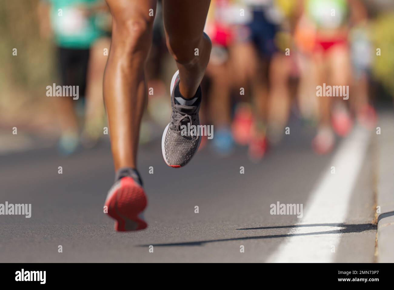 Marathon running race, people feet on city road Stock Photo - Alamy