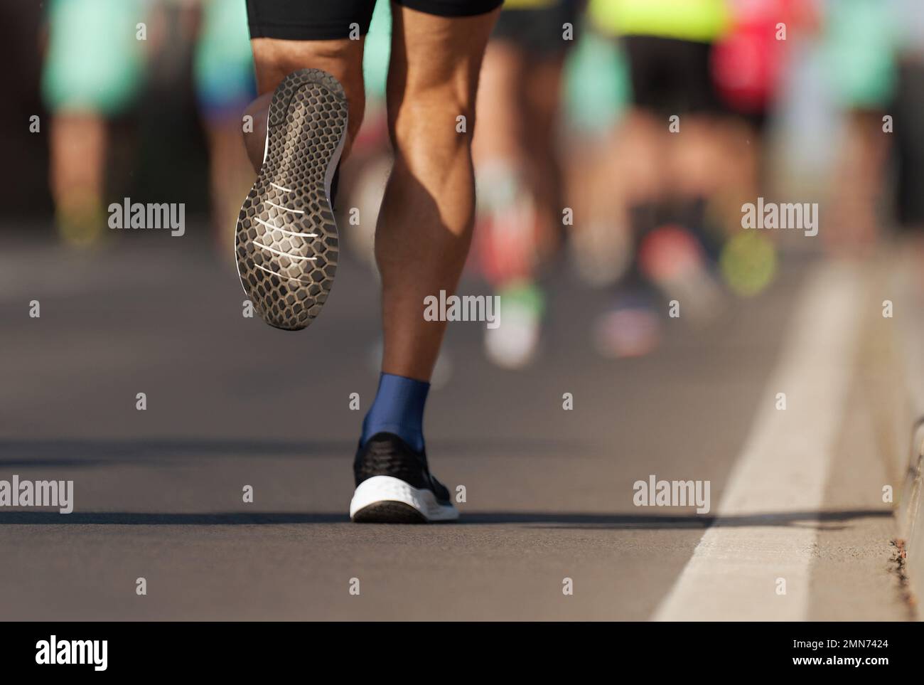 Marathon running race, people feet on city road Stock Photo - Alamy
