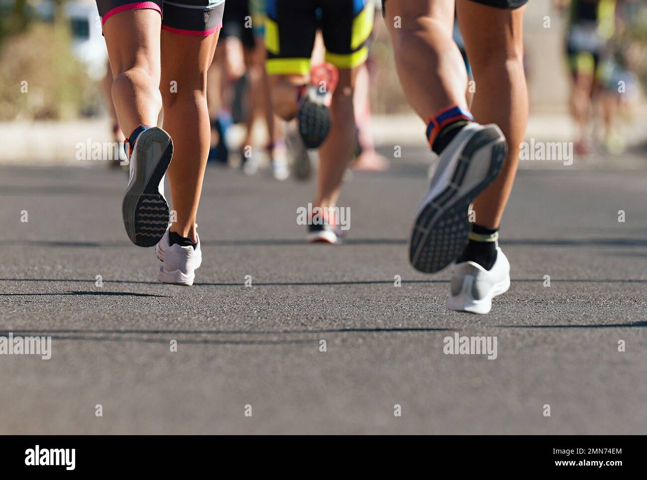 Marathon running race, people feet on city road Stock Photo - Alamy