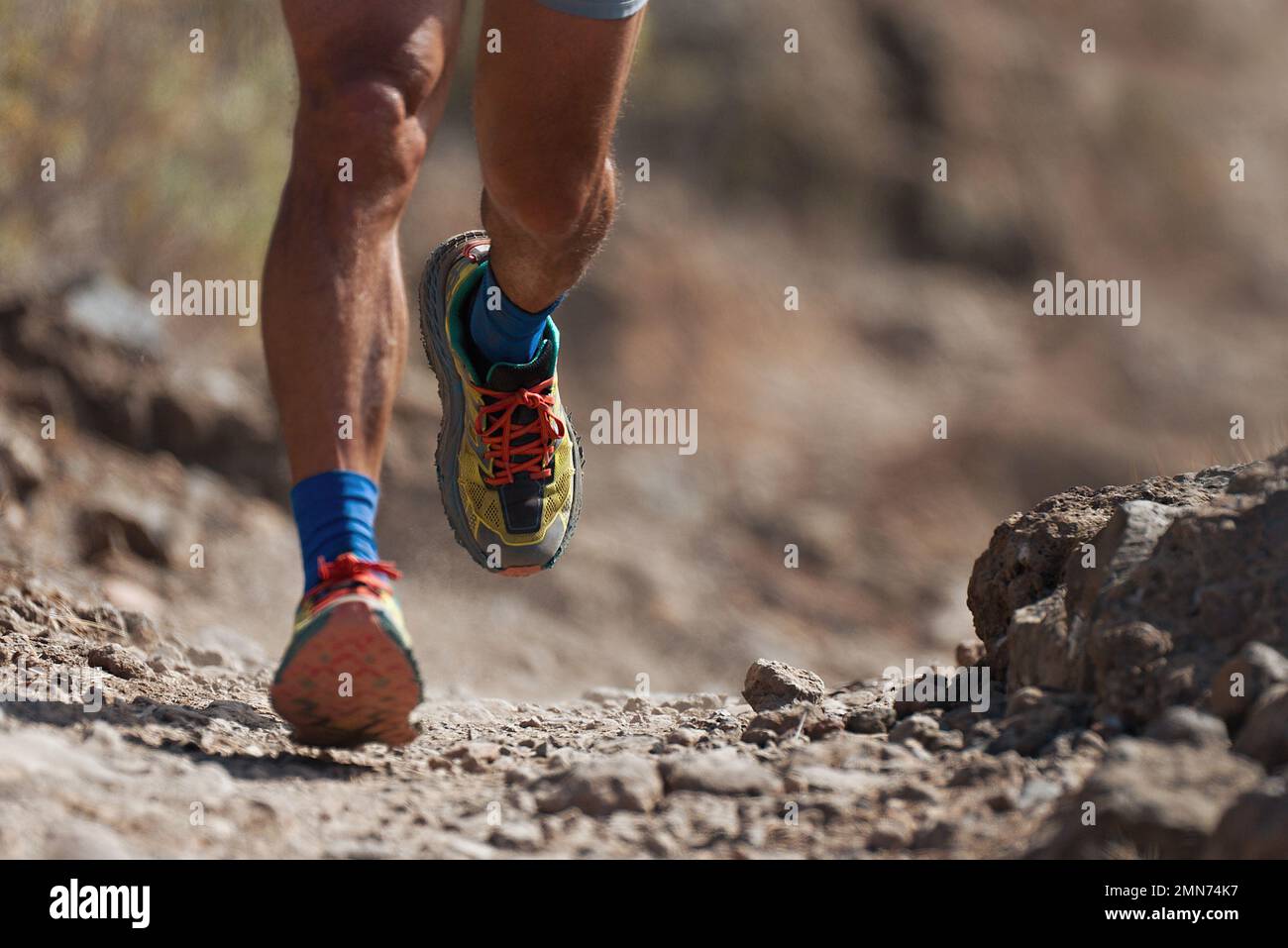 Trail running action close up of running shoes in action Stock Photo - Alamy