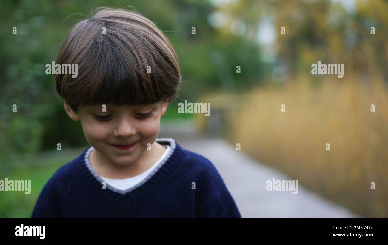 Little boy walking outside in nature. Handsome child enjoying park ...