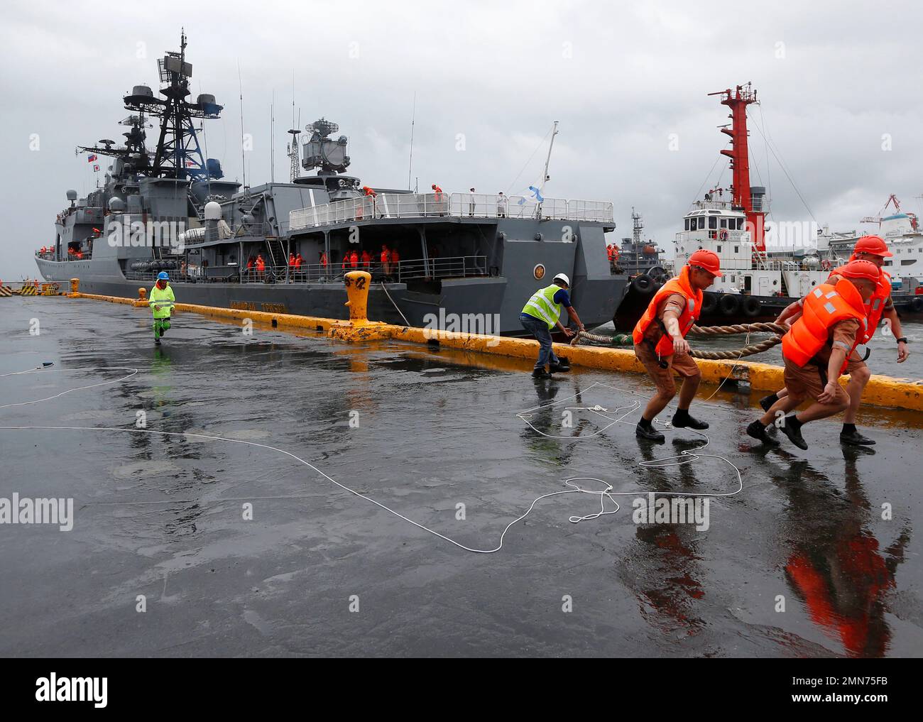 Russian sailors fix their line as the Russian Navy Anti-submarine ship ...