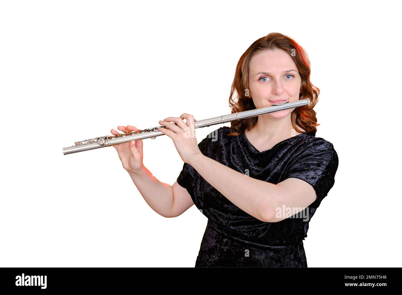 Portrait of a woman musician with a flute on a studio isolated white ...