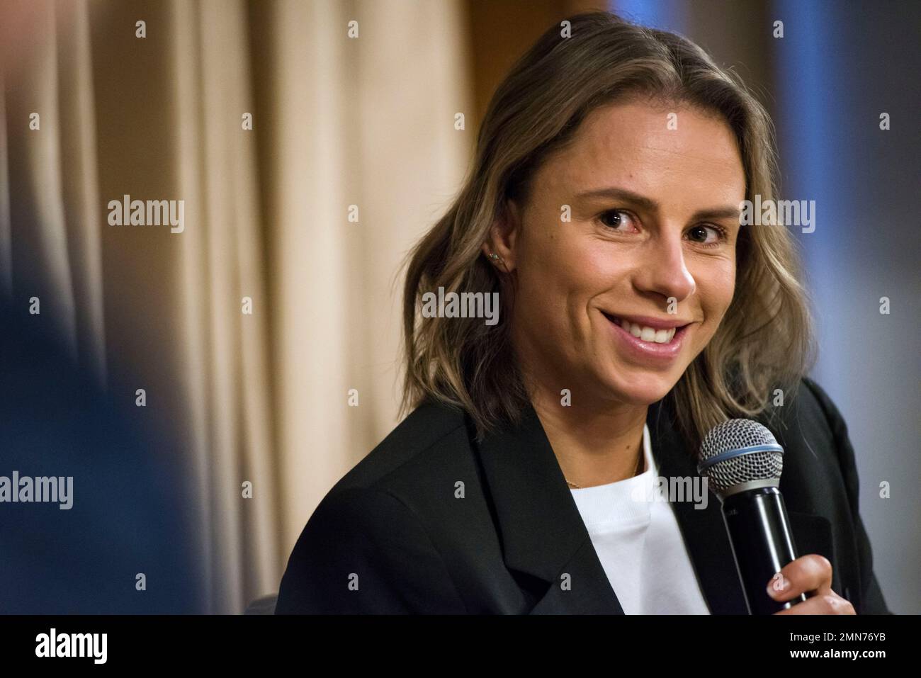 Magda Linette speaks during a press conference in Warsaw. Polish tennis ...