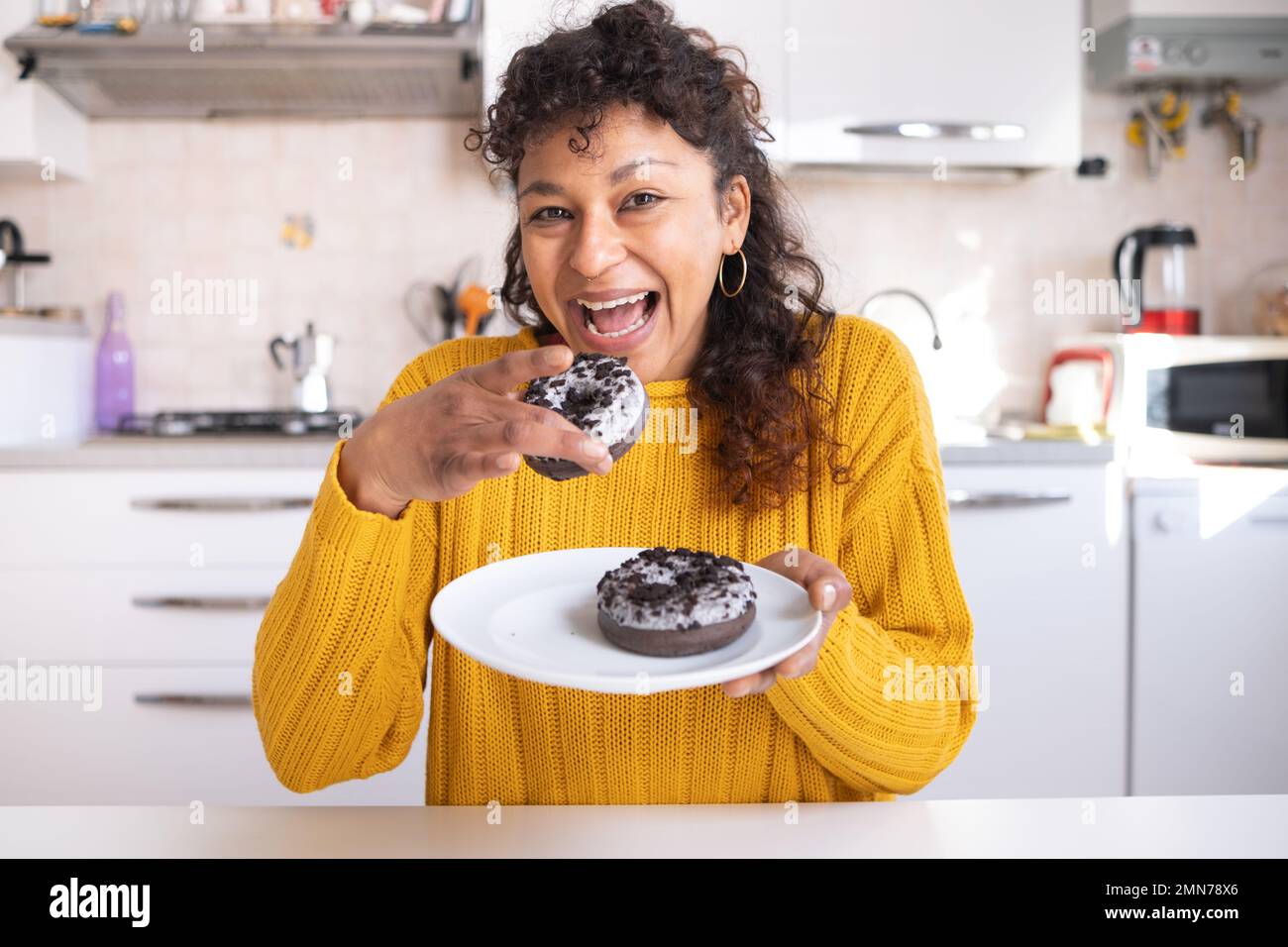 Binge eating woman hi-res stock photography and images - Alamy