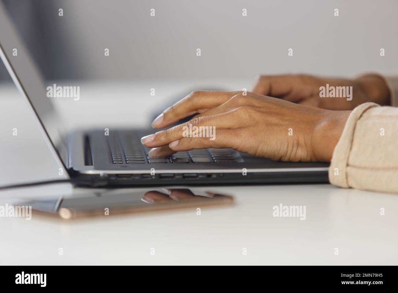 BIPOC woman typing text on laptop keyboard. Close up photo of POC ...