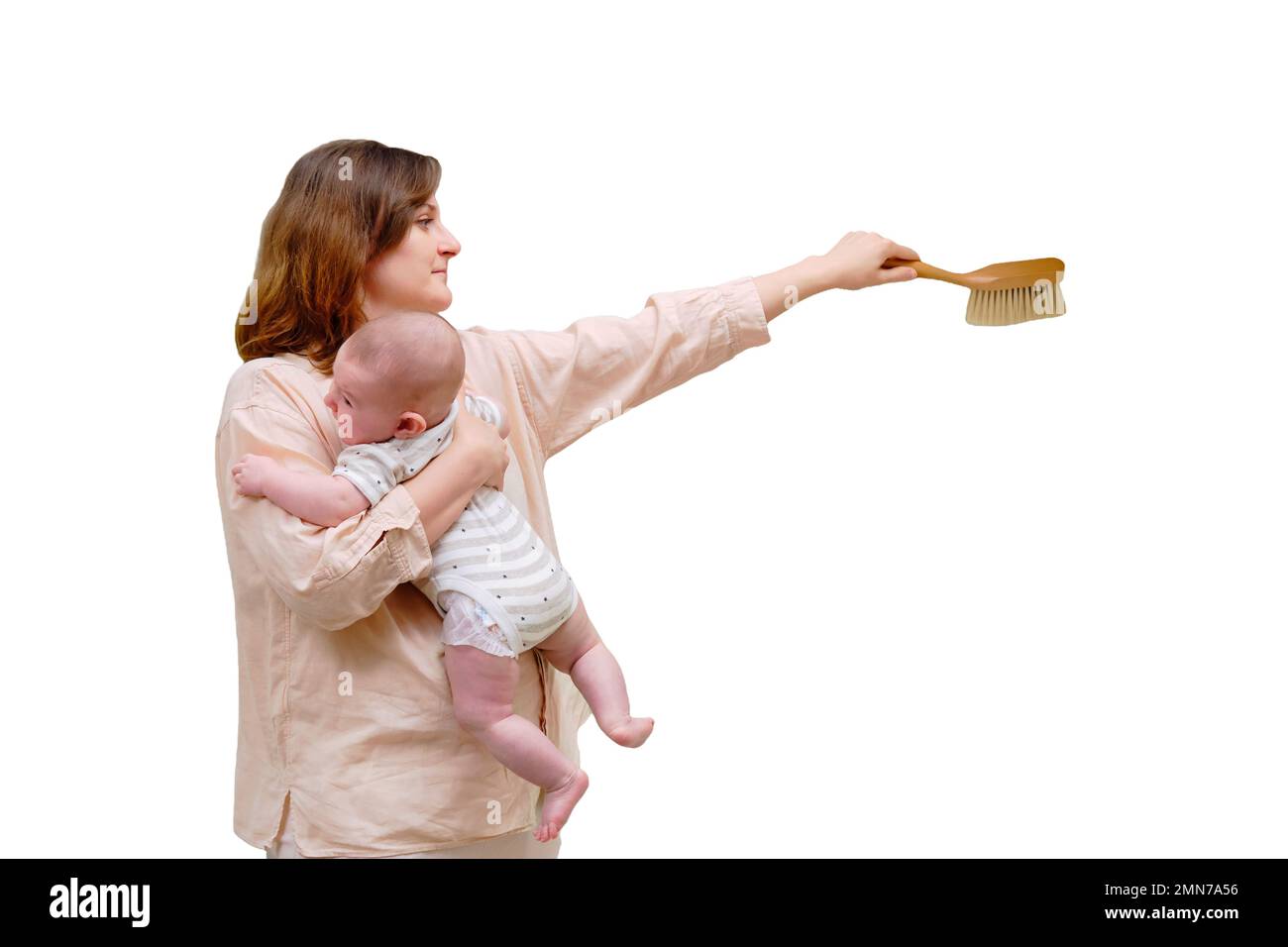 Woman cleans the home living room with an infant baby in her arms ...