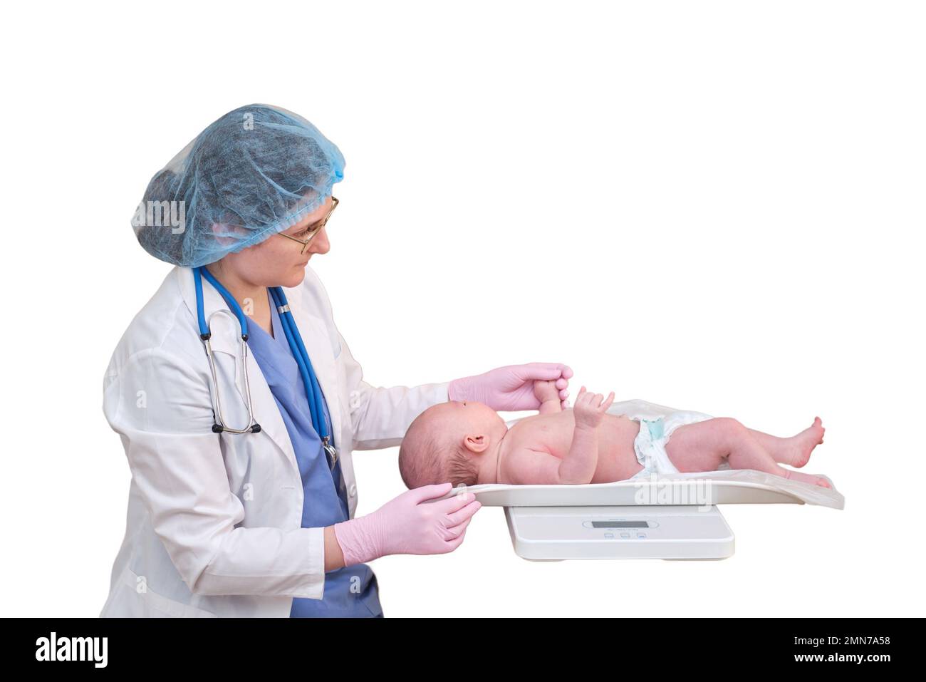 The doctor weighs a newborn baby on a scale, isolated on a white ...