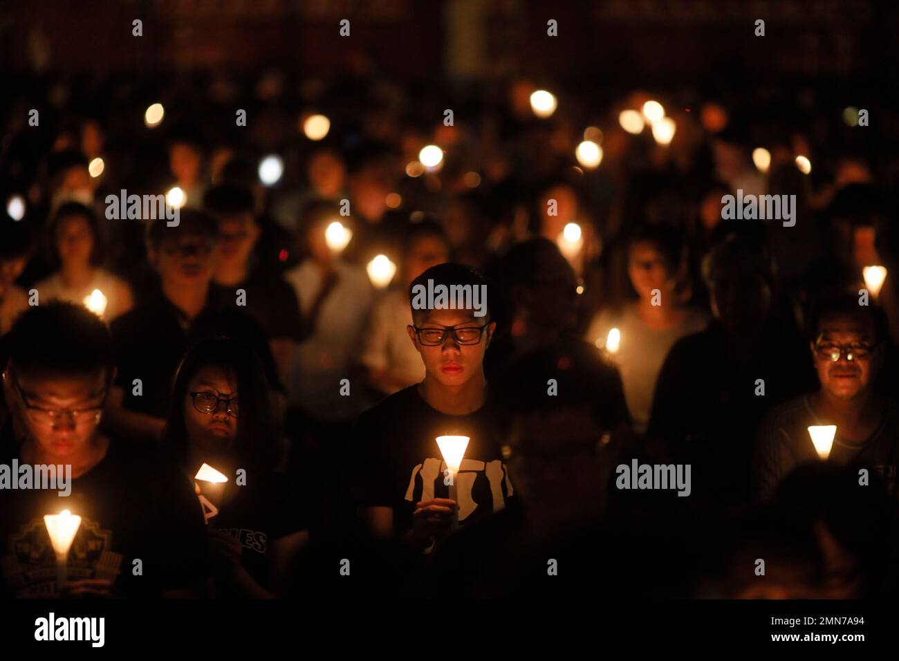 In this June 4, 2018, photo, tens of thousands of people attend an annual candlelight vigil at ...