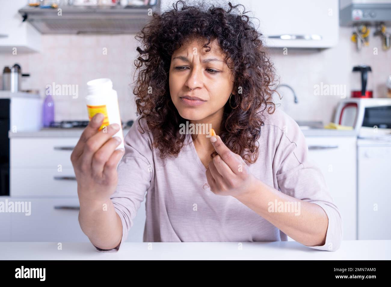 Woman checking label pill hi-res stock photography and images - Alamy