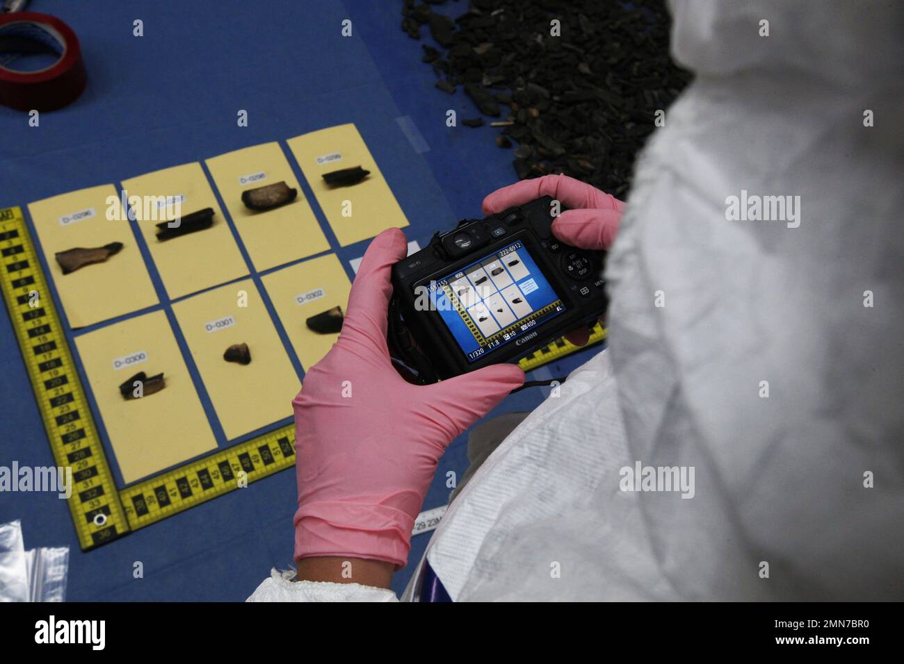 In this March 23, 2018 photo, an Argentine Forensic Anthropology Team ...