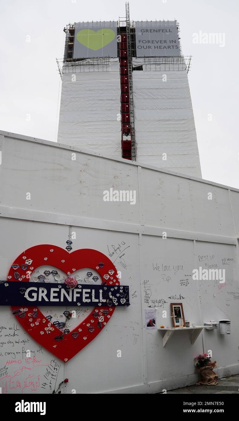 Banners, one with a green heart, are unveiled on the outside of ...