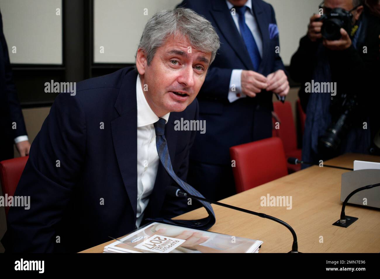 Lactalis CEO Emmanuel Besnier takes a seat as he arrives for a hearing ...