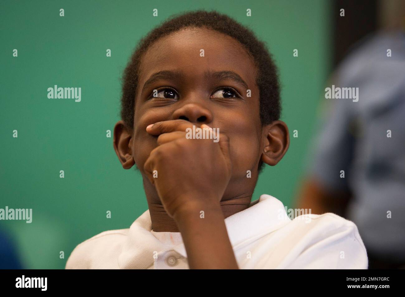 Second grade student Nobel Daniel reacts to having a new pair of Nike ...