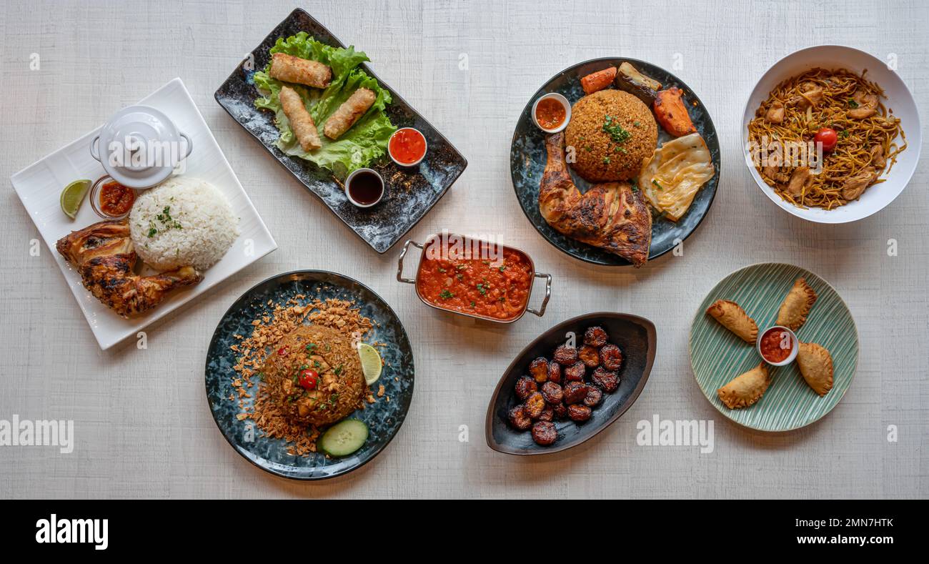 African and Thai culinary Still Life. Mix of African and Thai dishes ...