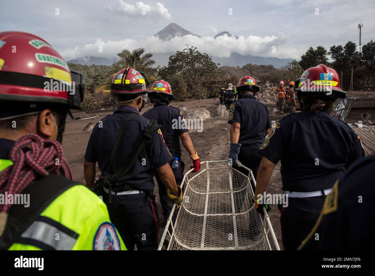 Volcan de Fuego, or "Volcano of Fire," releases a white plume of smoke ...