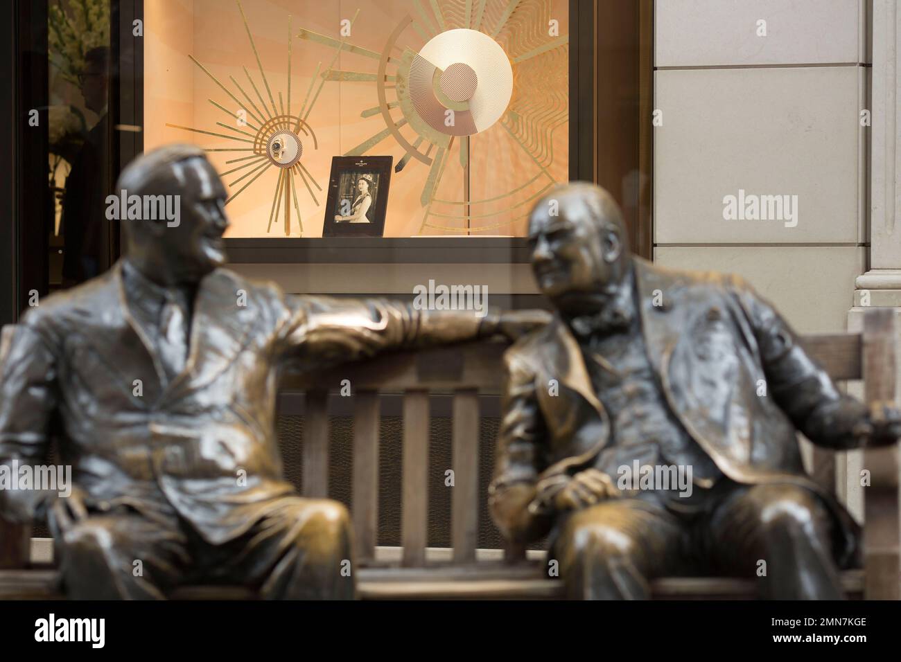 A portrait of Queen Elizabeth II is displayed in a shop window in ...