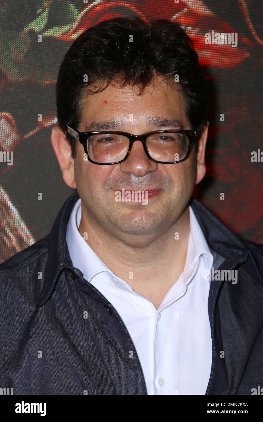 Director Peter Ettedgui poses for photographers upon arrival at the premiere of McQueen in ...