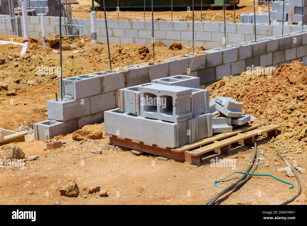 Cement building blocks stacked on pallets used for transportation and ...