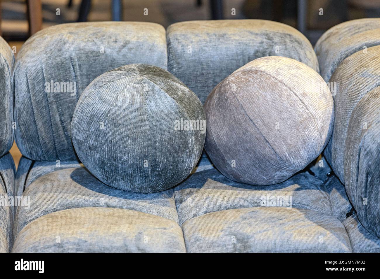 Ball Shape Plush Pillows at Sofa in Living Room Stock Photo - Alamy