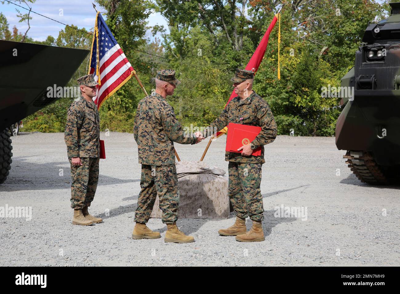 Marine Corps Systems Command Sgt. Maj. Allen Goodyear, left, looks on ...