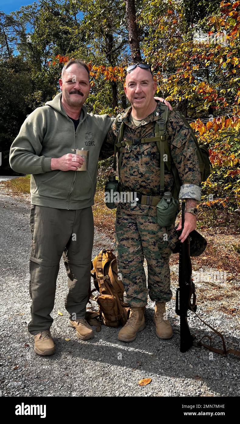 Marine Corps Systems Command Sgt. Maj. Allen Goodyear, left, looks on as Gen. Eric M. Smith ...