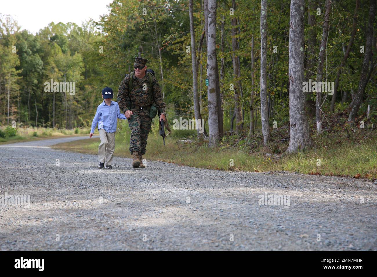Col. Mullins was accompanied by his 8-year-old grandson, Blake, during ...
