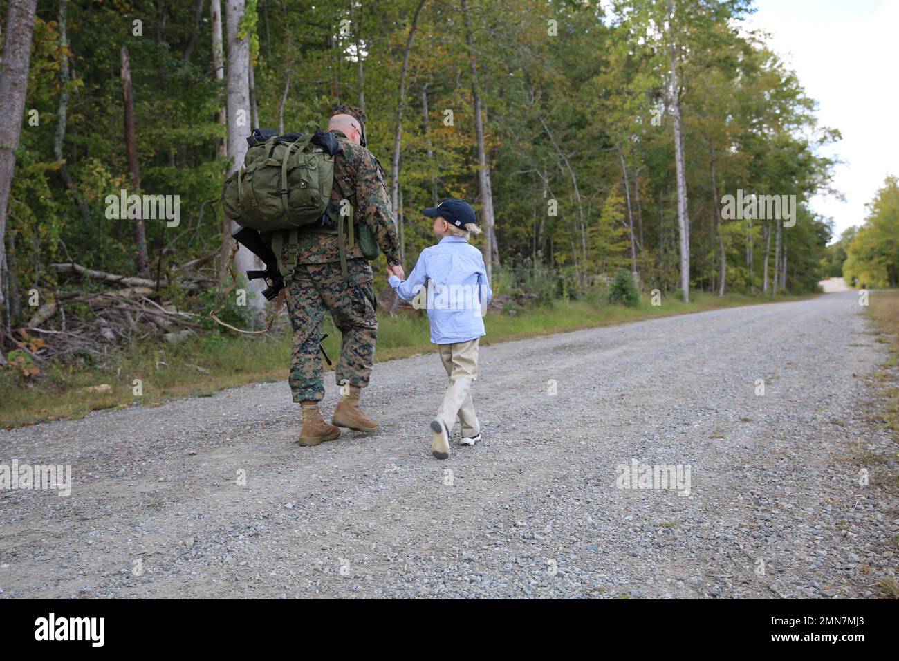 Col. Mullins was accompanied by his 8-year-old grandson, Blake, during ...