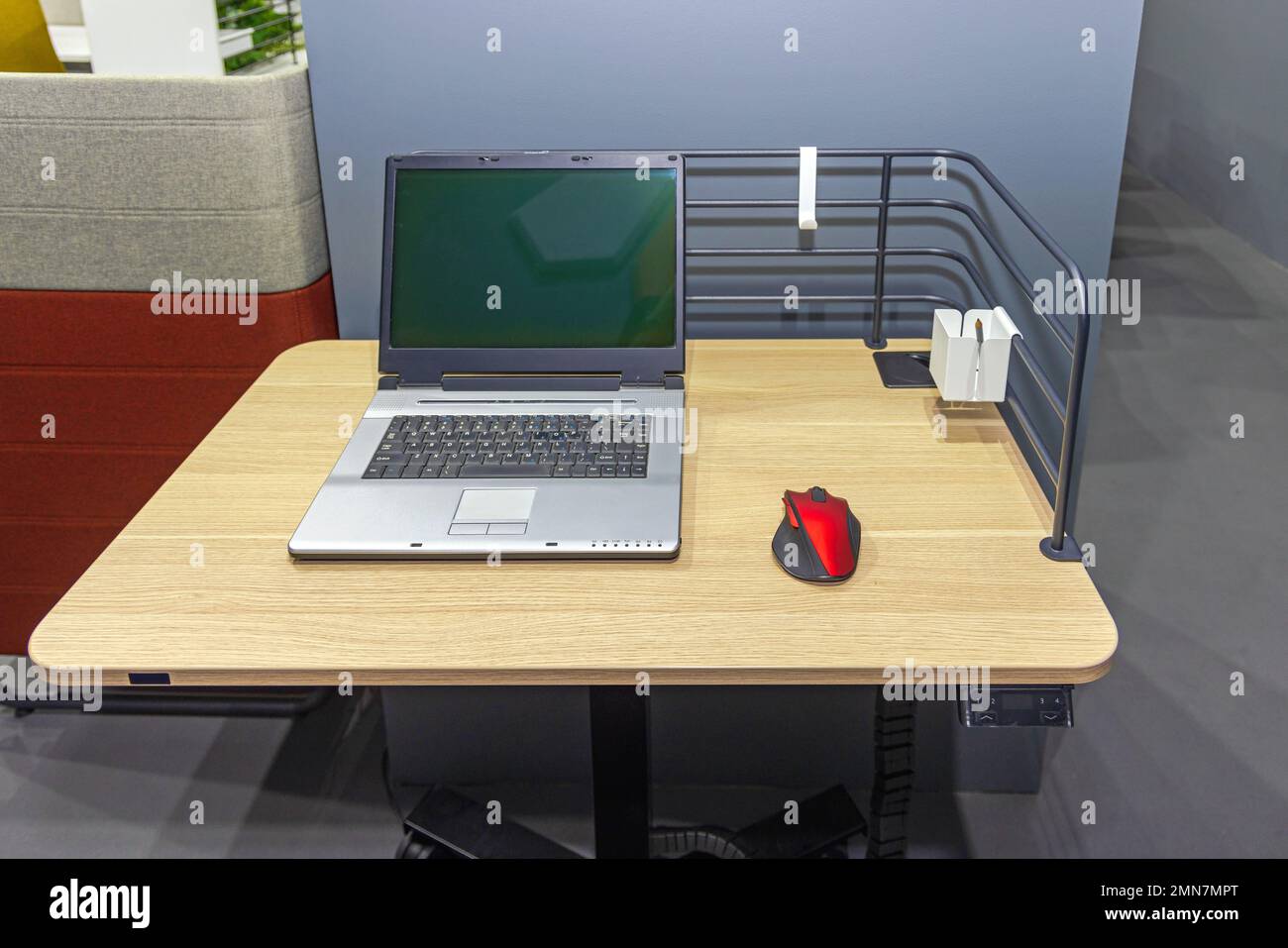 Small Standing Desk With Open Laptop Computer and Red Mouse Stock Photo ...