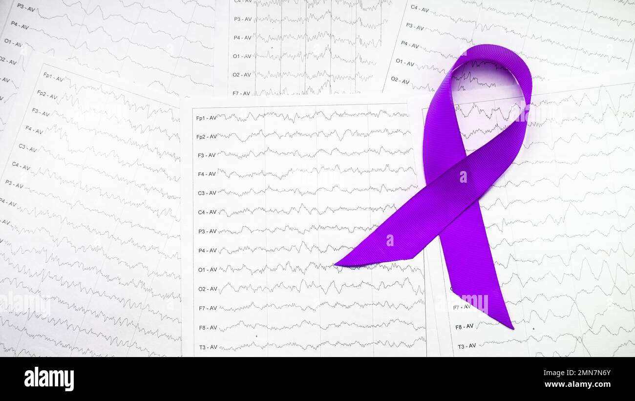 International Epilepsy Day, Epilepsy awareness. Purple ribbon on brain ...