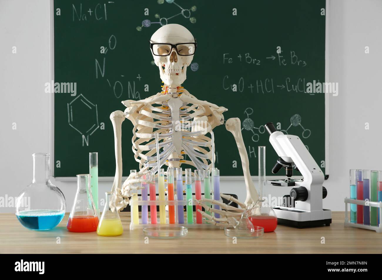 Skeleton and different chemistry glassware in classroom Stock Photo - Alamy