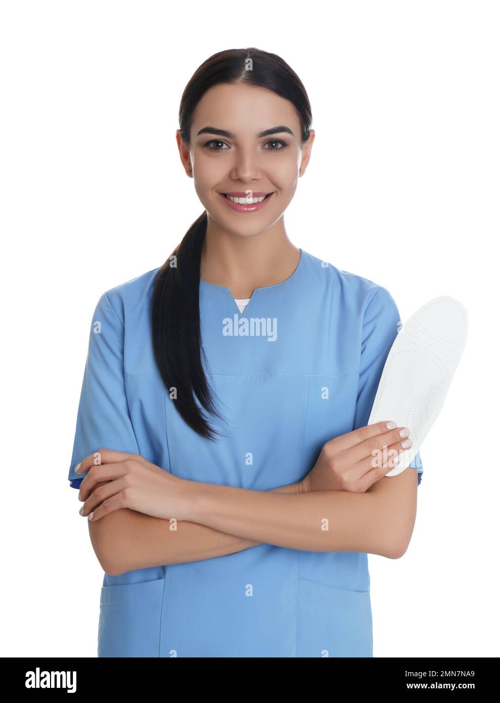Female orthopedist showing insole on white background Stock Photo - Alamy