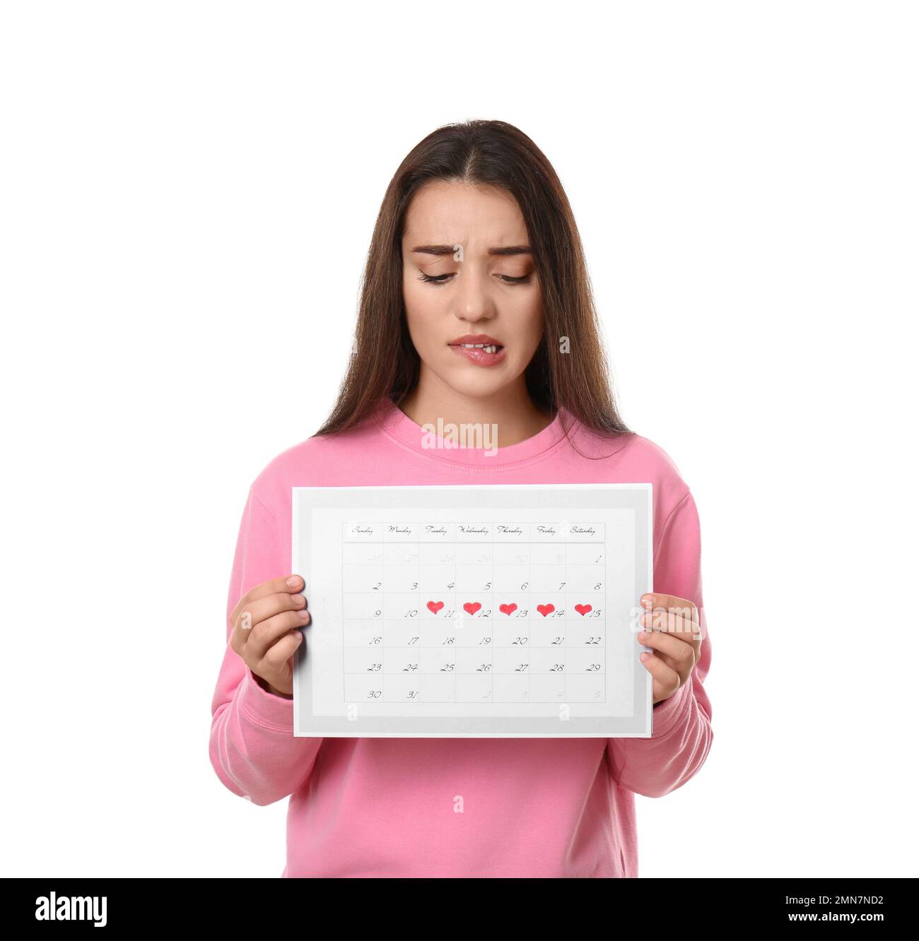 Young woman holding calendar with marked menstrual cycle days isolated ...
