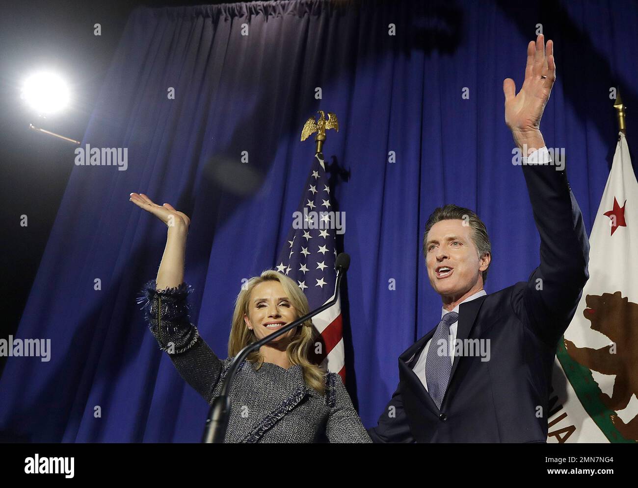 Democratic Lt. Gov. Gavin Newsom, right, waves with his wife ...