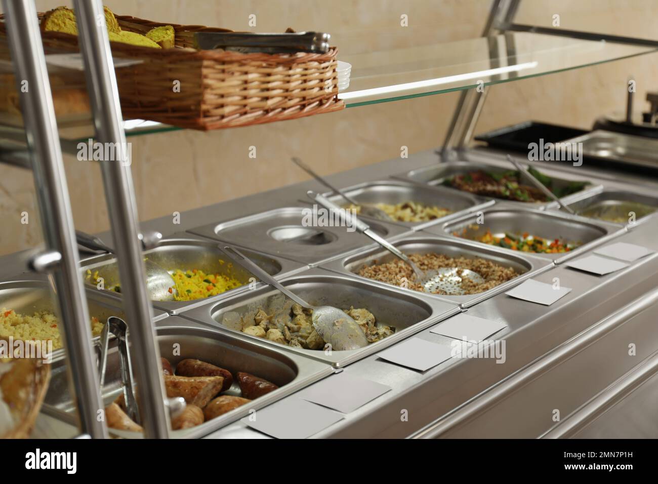 Containers with tasty food in school canteen Stock Photo - Alamy