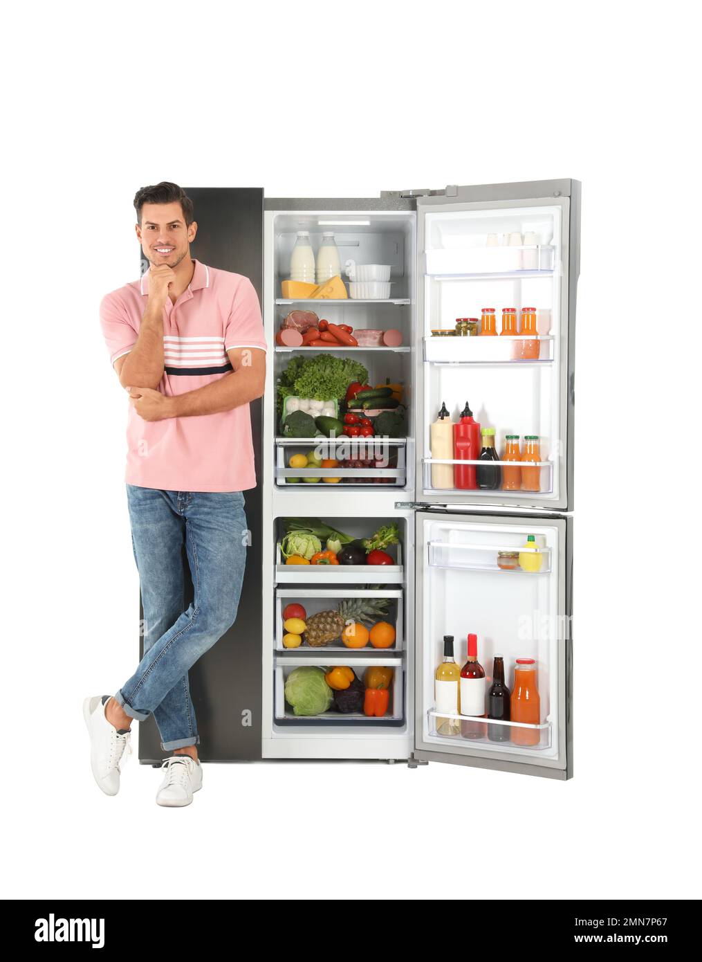 Man near open refrigerator on white background Stock Photo - Alamy