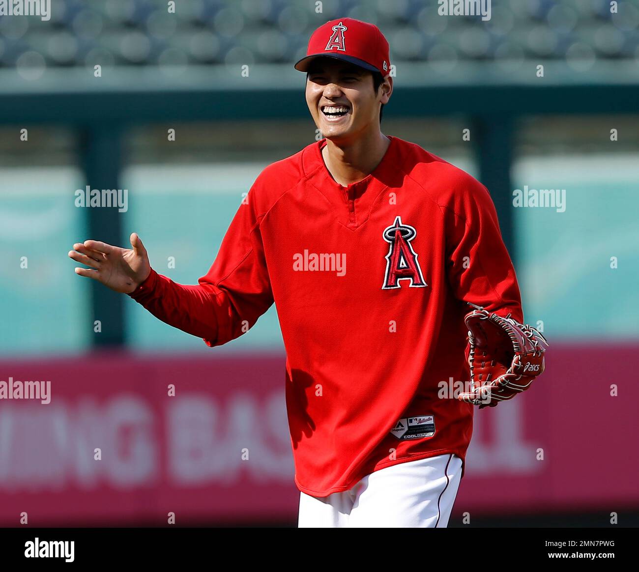 Los Angeles Angels' Shohei Ohtani laughs with his interpreter as ...