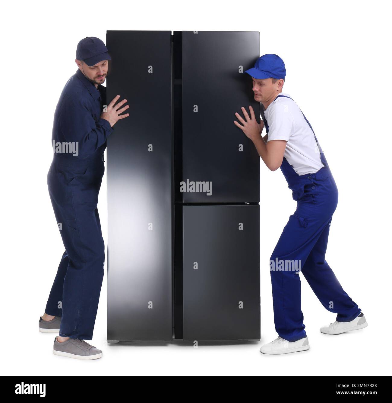 Professional workers carrying refrigerator on white background Stock ...