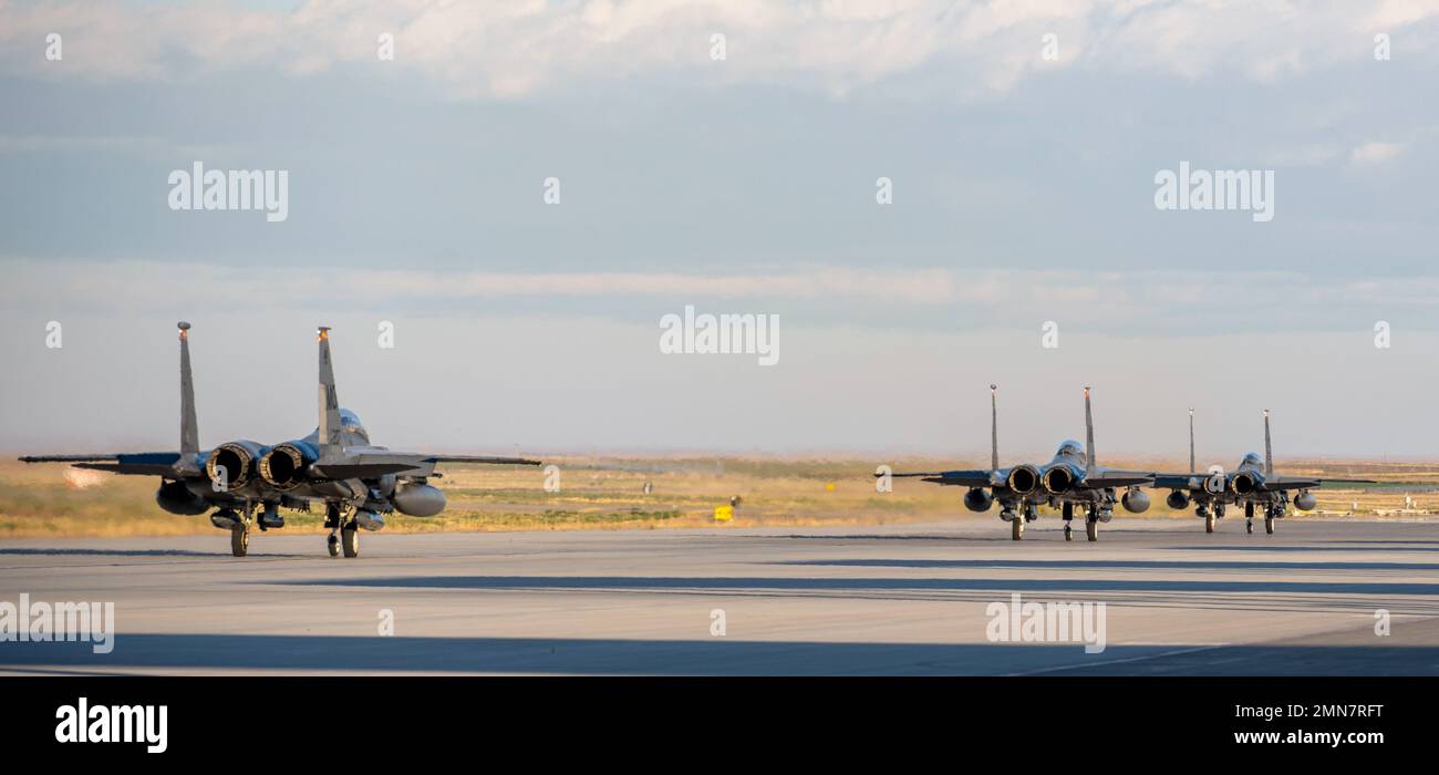 U.S. Air Force Airmen assigned to the 389th Fighter Squadron taxi F-15E ...