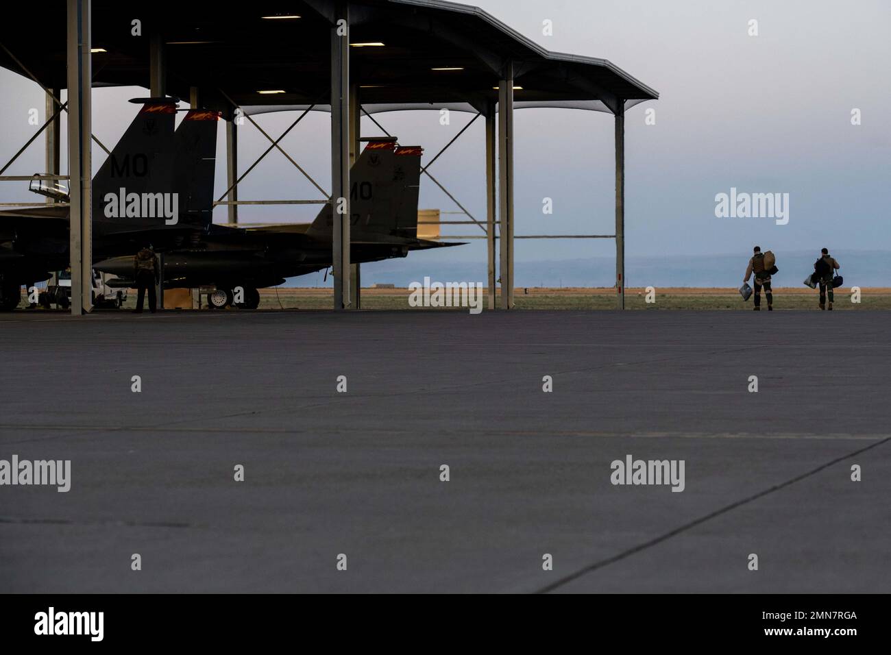 U.S. Air Force Airmen assigned to the 389th Fighter Squadron (FS) walk ...