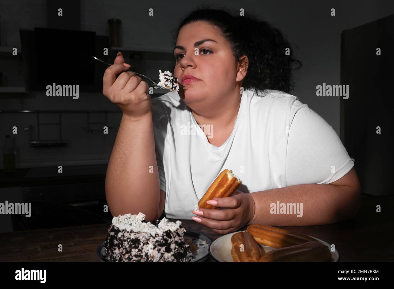 Woman eating sweets hi-res stock photography and images - Alamy