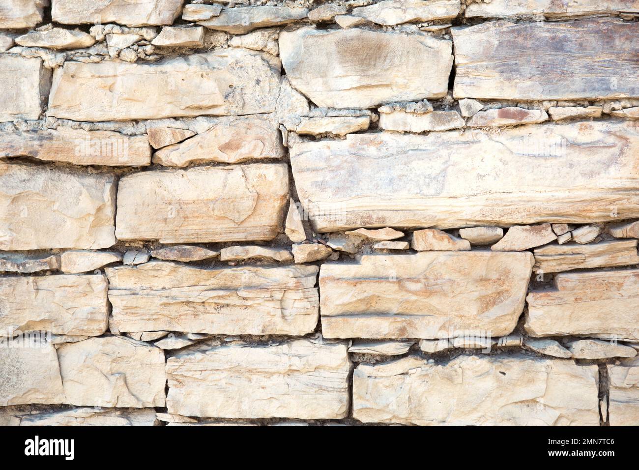 Masonry walls of natural sand color. Stone texture close-up ...