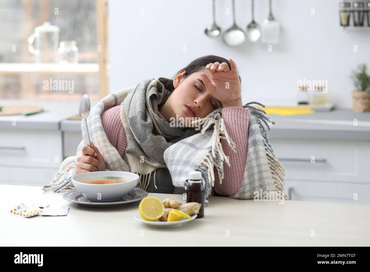 Sick woman kitchen table hi-res stock photography and images - Alamy