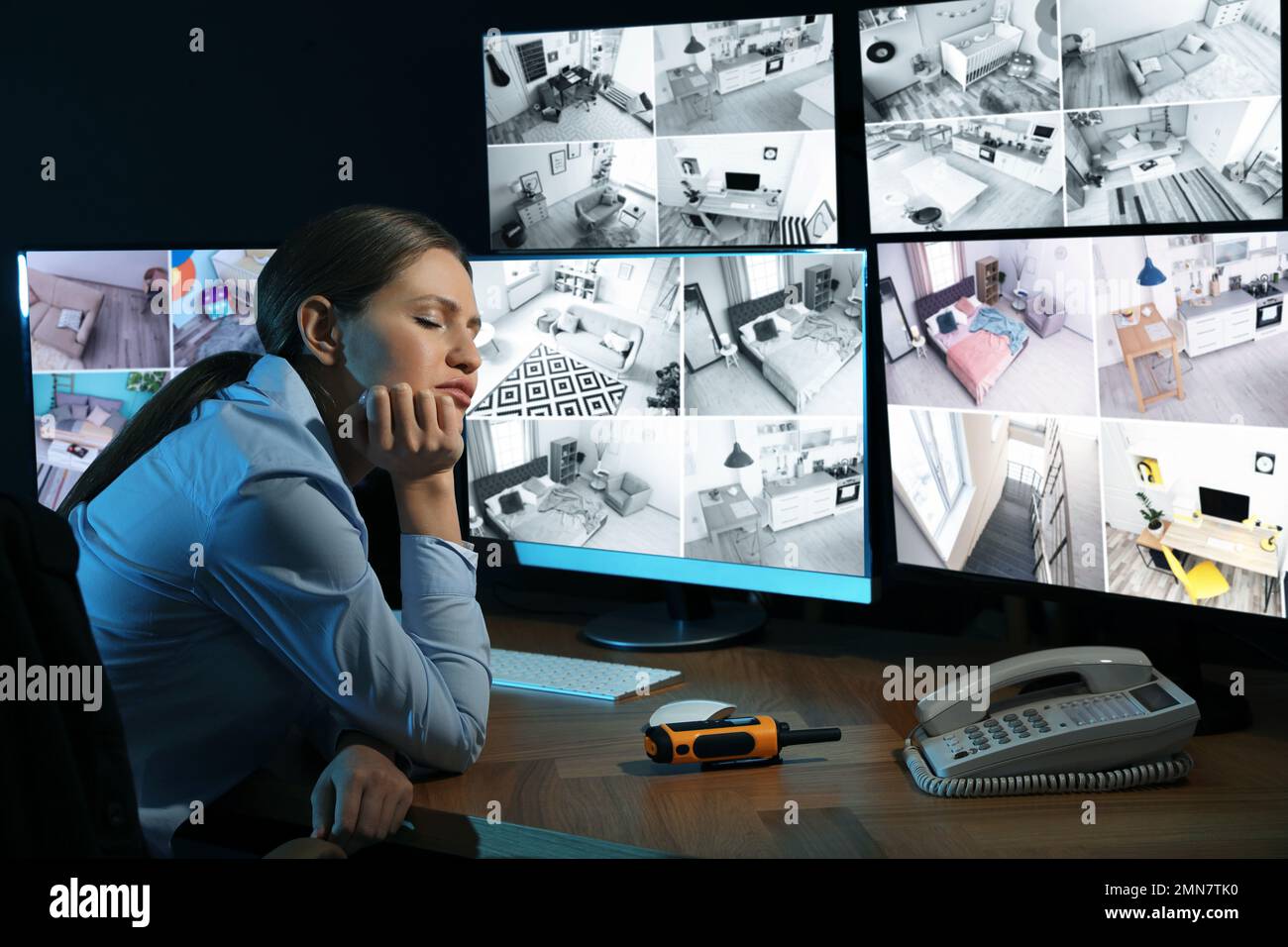 Tired security guard sleeping in office at night Stock Photo - Alamy