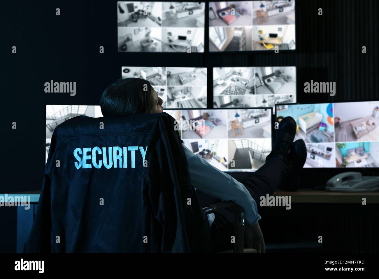 Tired security guard sleeping in office at night Stock Photo - Alamy