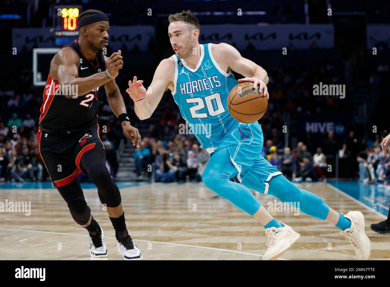 Charlotte Hornets forward Gordon Hayward (20) drives against Miami Heat forward Jimmy Butler ...